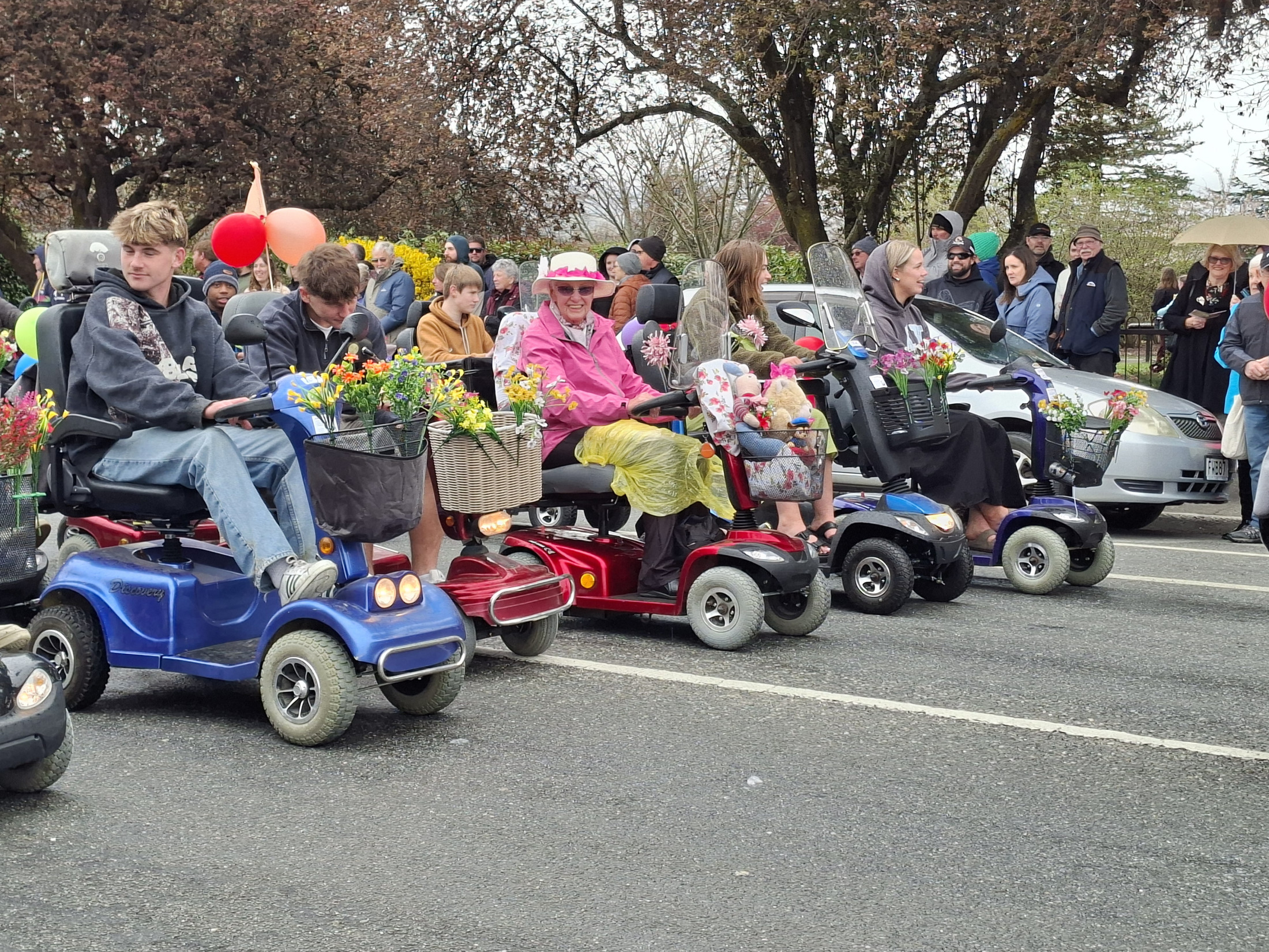 Senior Students Ride Mobility Scooters in Blossom Festival Parade